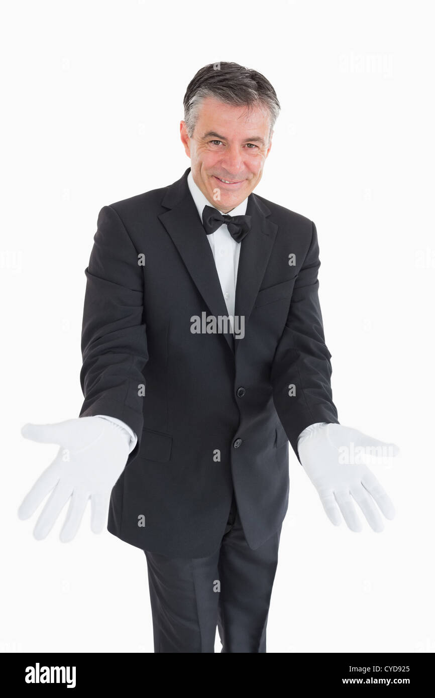 Waiter waiting with opened arms Stock Photo - Alamy