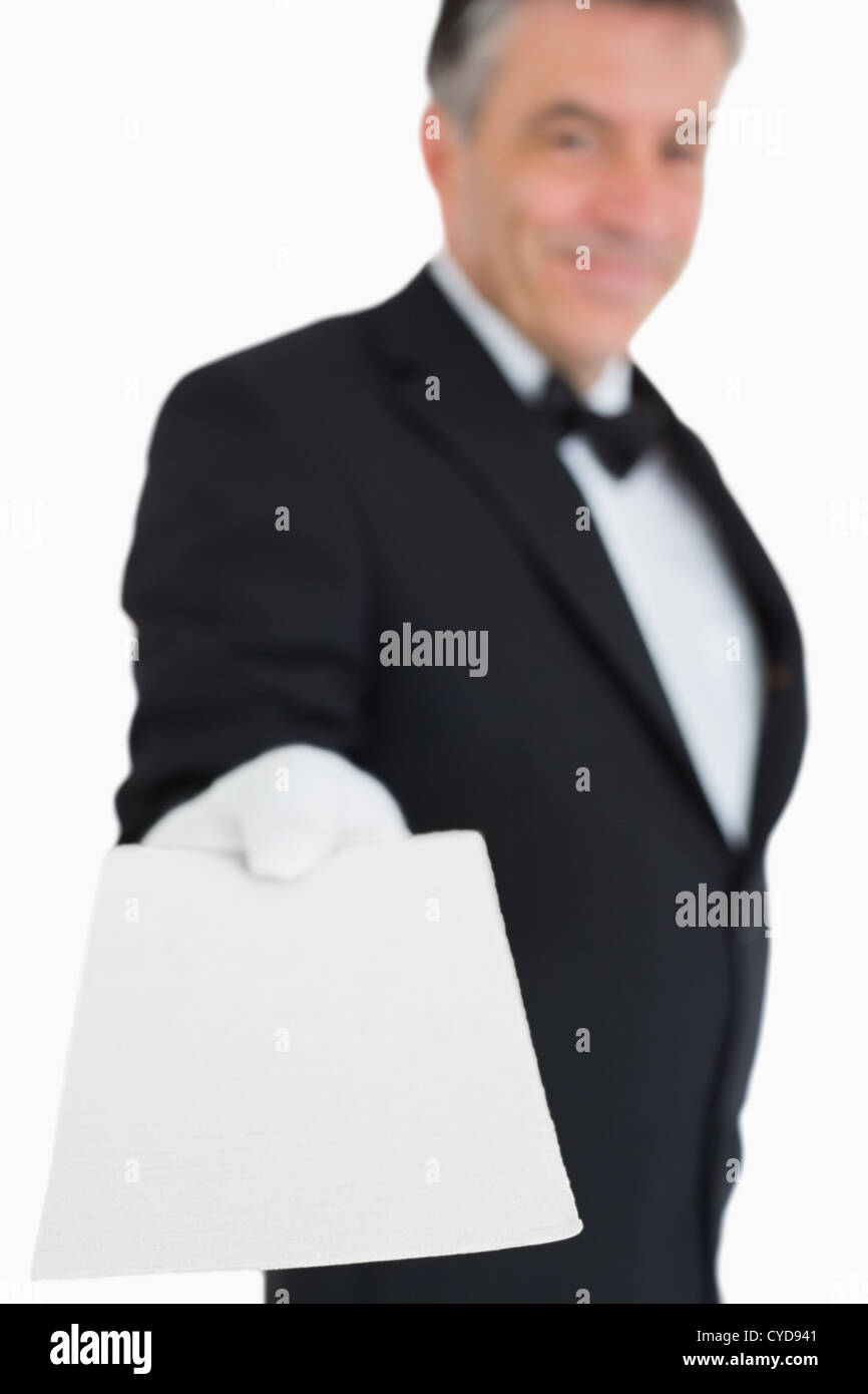 Waiter giving a card Stock Photo - Alamy