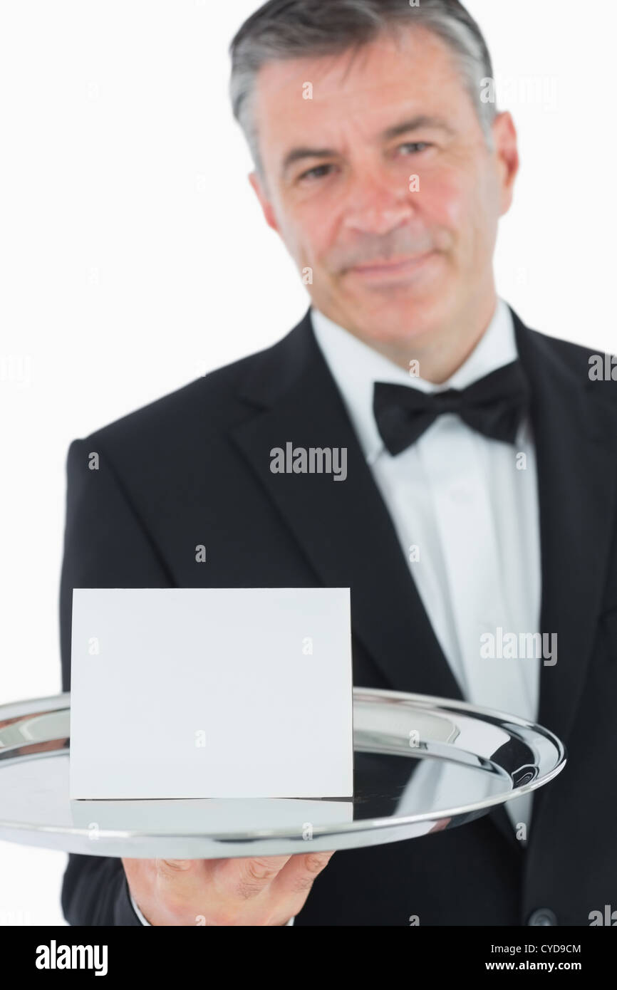 Waiter holding tray with paper Stock Photo - Alamy