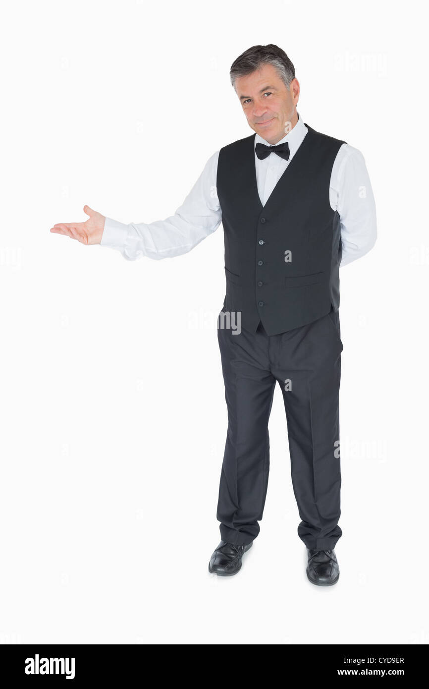 Man in suit showing something Stock Photo - Alamy