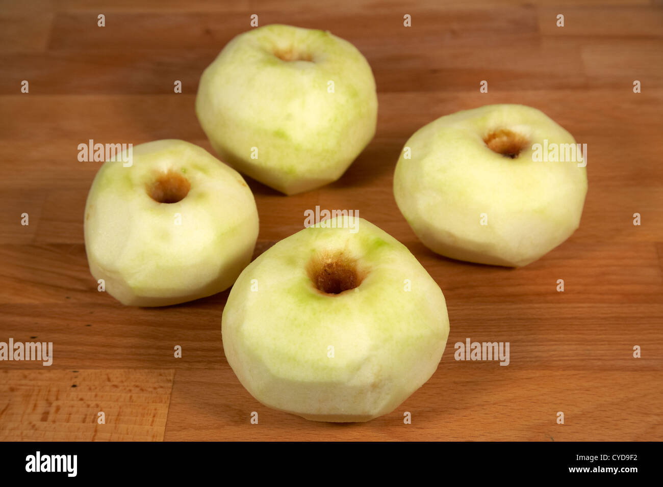four peeled bramley cooking apples Stock Photo - Alamy