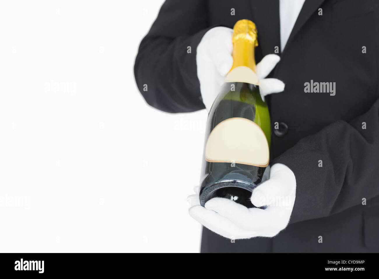 Waiter presenting champagne bottle Stock Photo - Alamy