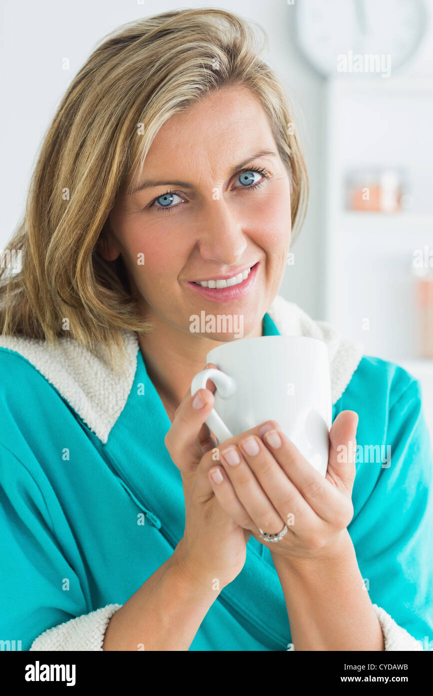 Woman in dressing gown looking directly into the camera Stock Photo - Alamy