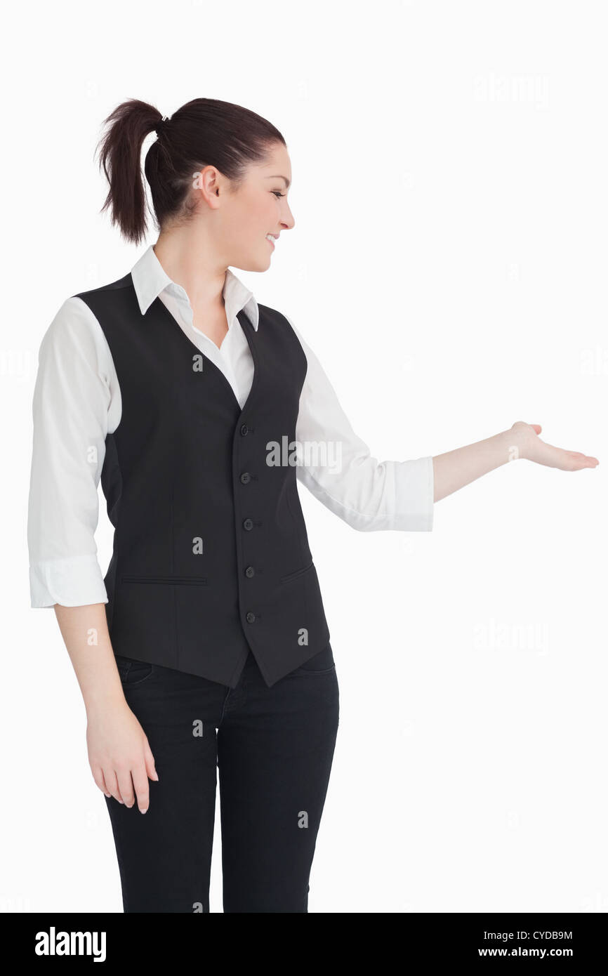 Woman showing us something Stock Photo - Alamy