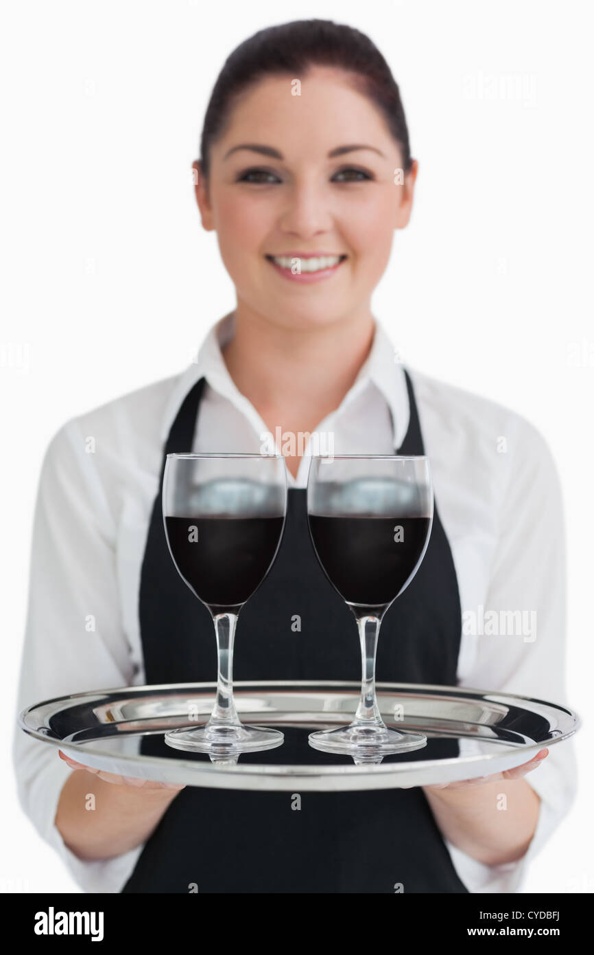 Waitress holding two glasses of wine Stock Photo - Alamy