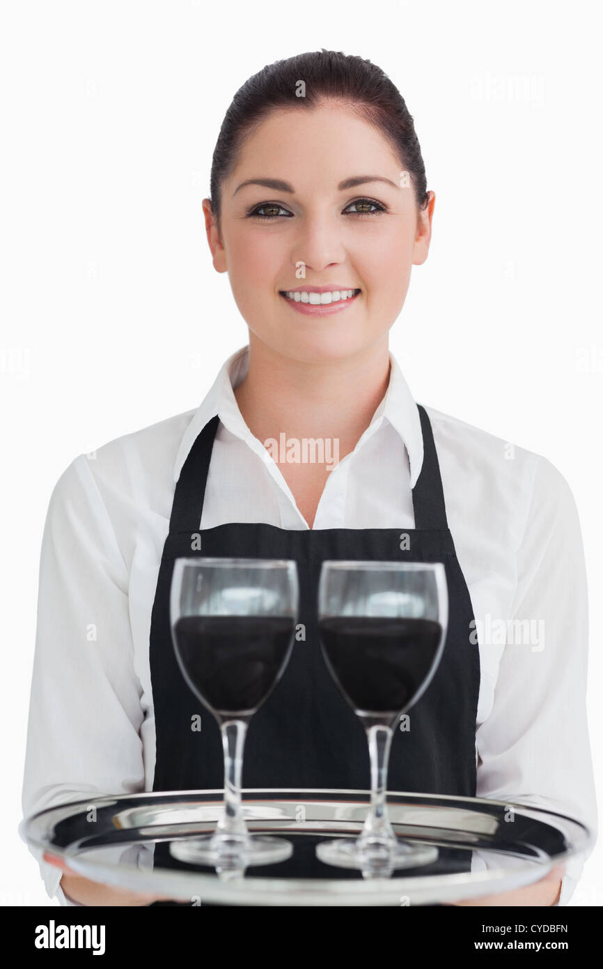 Smiling waitress holding two glasses of wine Stock Photo - Alamy