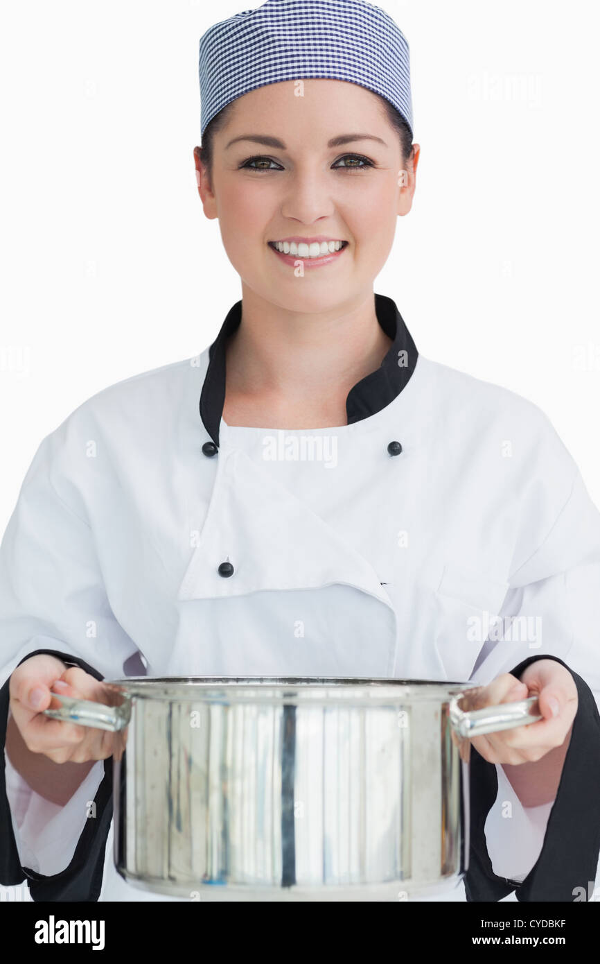 Cook holding a big pot Stock Photo - Alamy