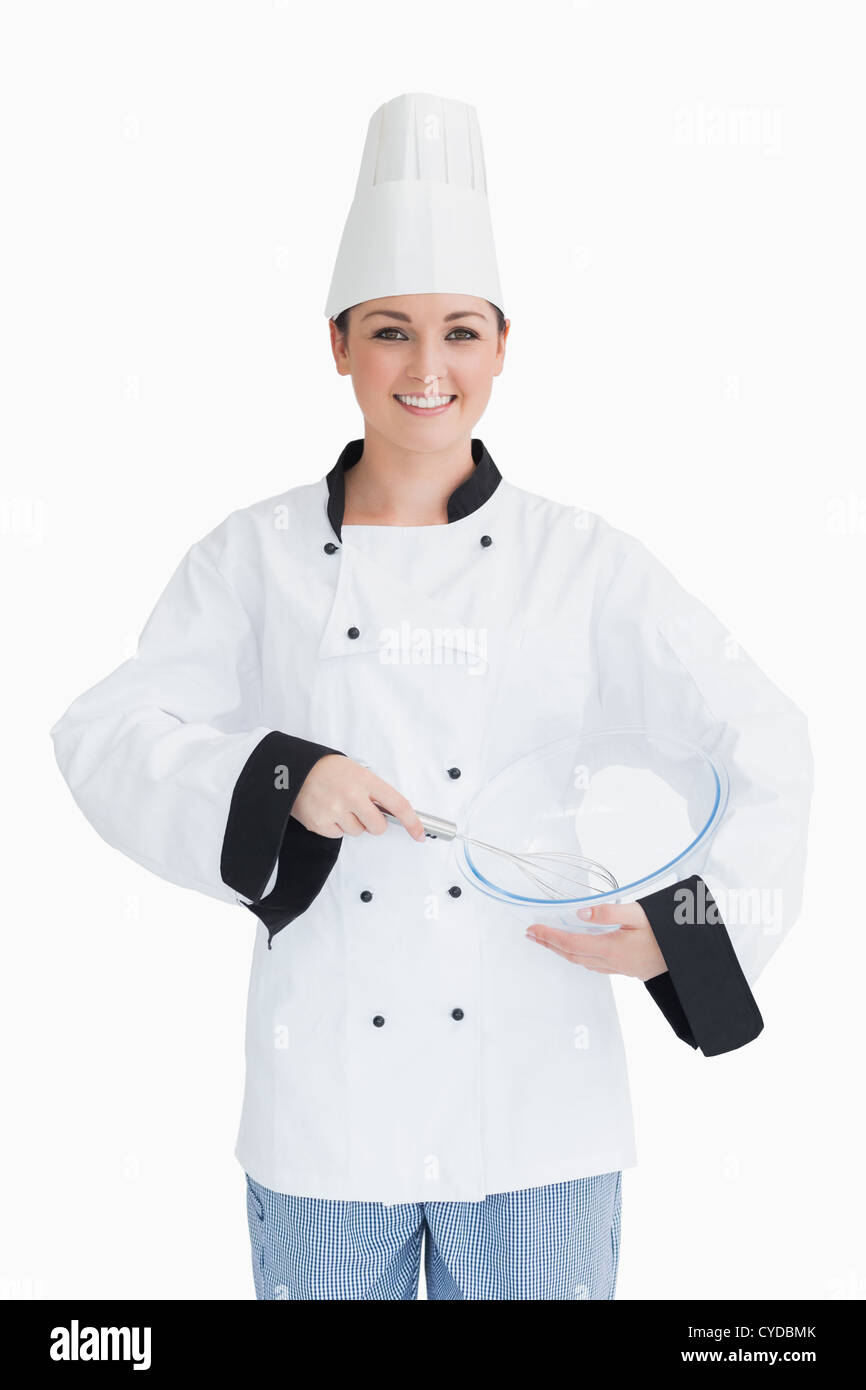 Cook using whisk and bowl Stock Photo - Alamy