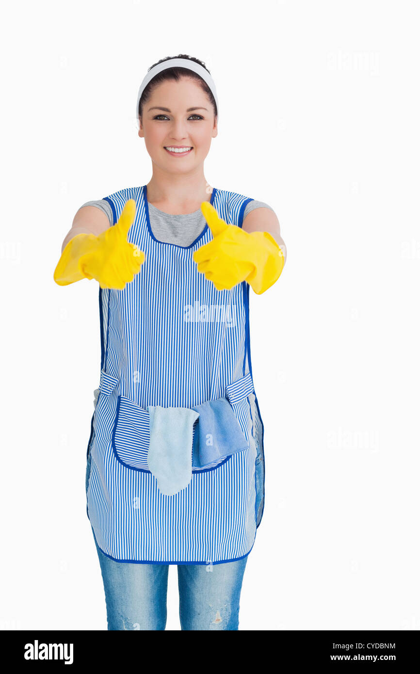 Cleaning woman giving thumbs up with yellow gloves Stock Photo - Alamy