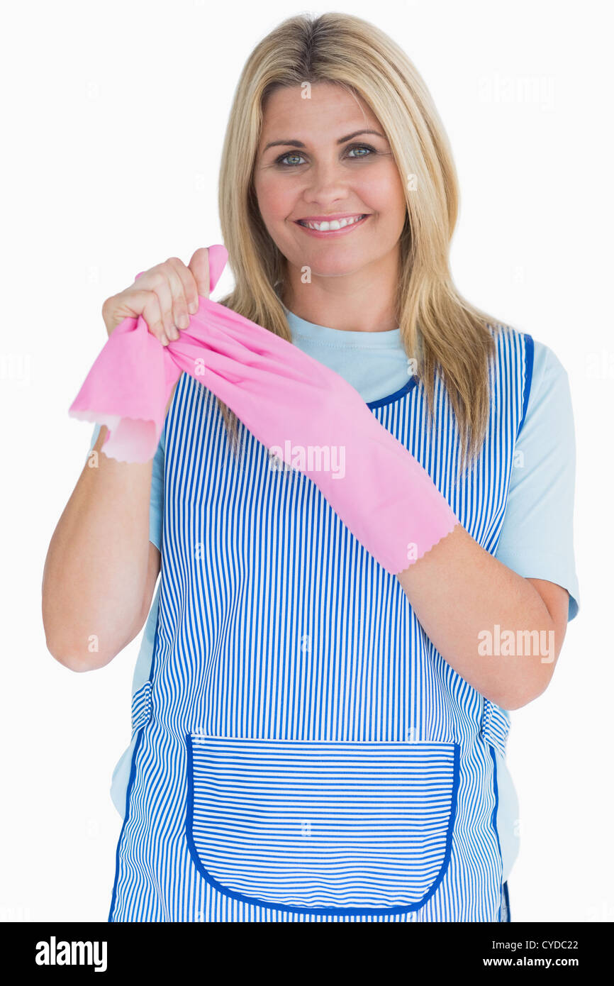 Woman taking off rubber gloves hi-res stock photography and images - Alamy