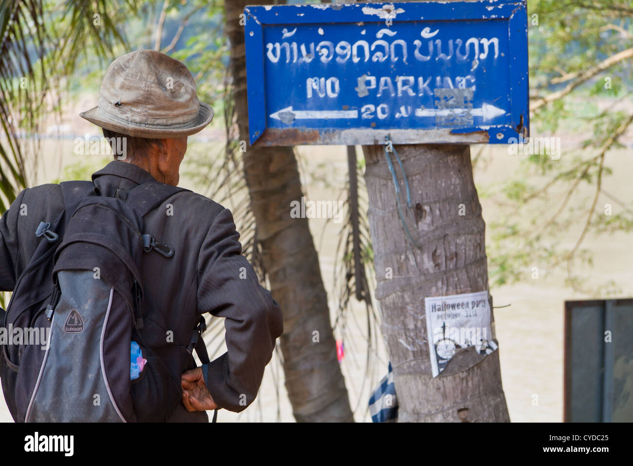 Man looking at Signpost in Luang Prabang, Laos Stock Photo - Alamy