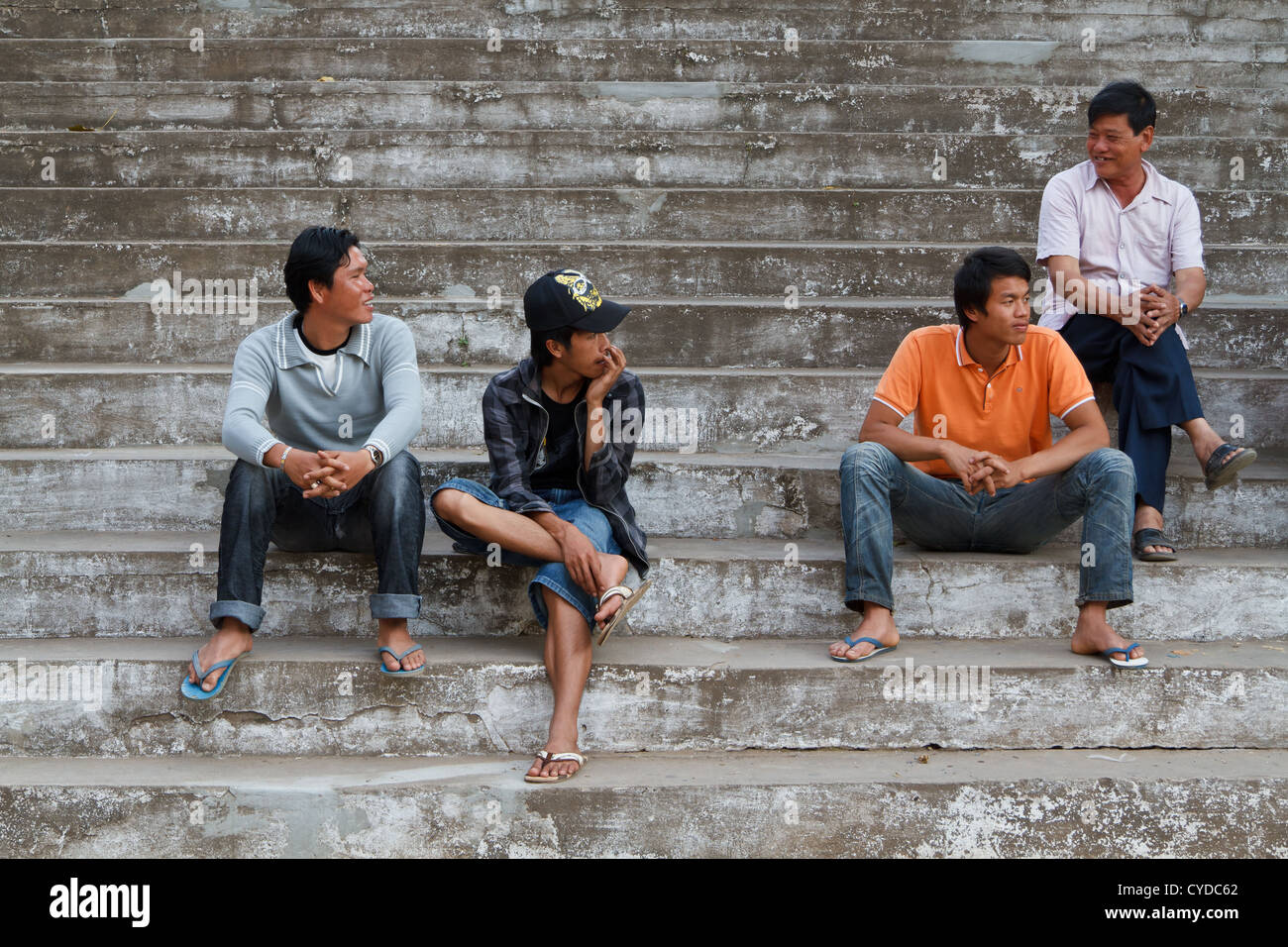 Local Men sitting on a Staircase in Luang Prabang, Laos Stock Photo - Alamy