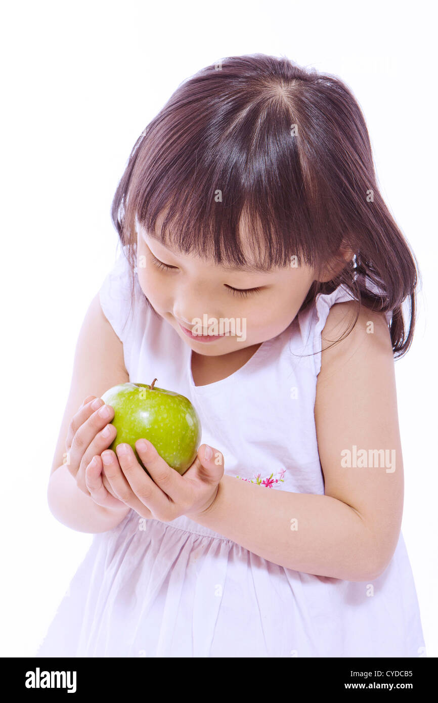 A girl holding an apple in her hands,portrait Stock Photo - Alamy
