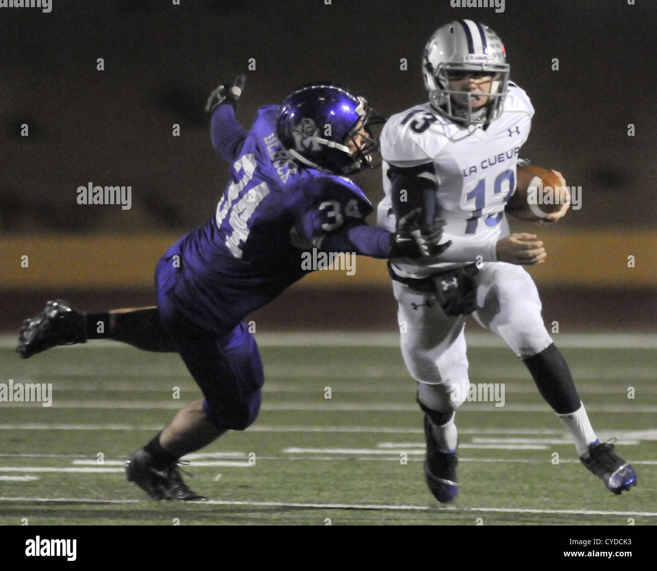Nov. 1, 2012 - Albuquerque, NM, U.S. - Greg Sorber -- Manzano's Derek Debuck, 34, gets a hand on ...