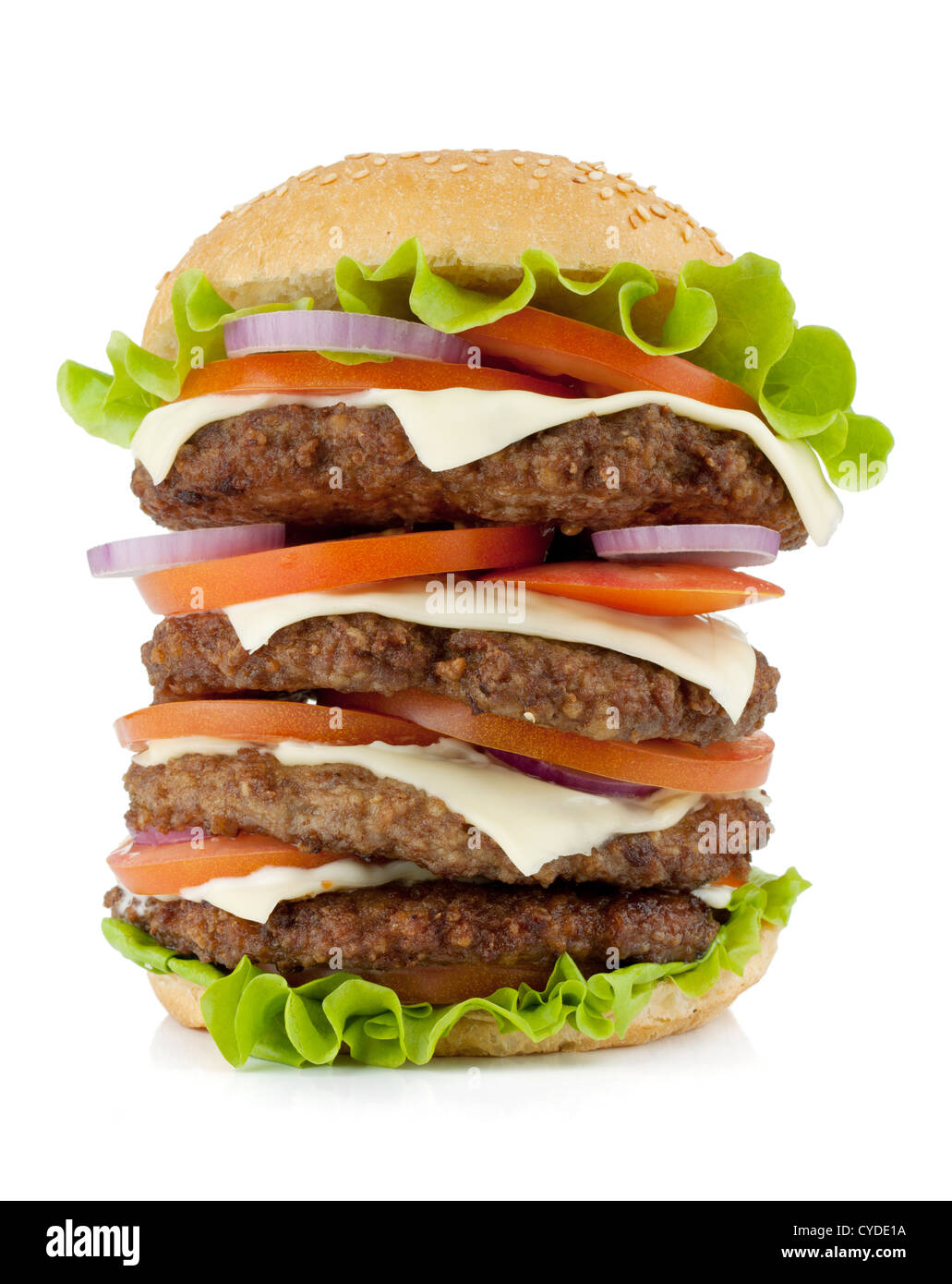 Very large burger with beef, cheese, onion and tomatoes. Isolated on ...