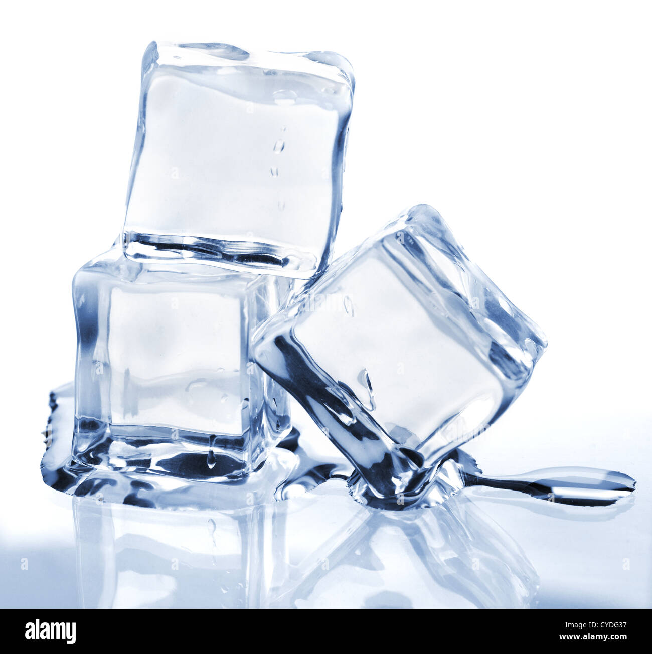 Three melting ice cubes on glass table. On white background Stock Photo ...