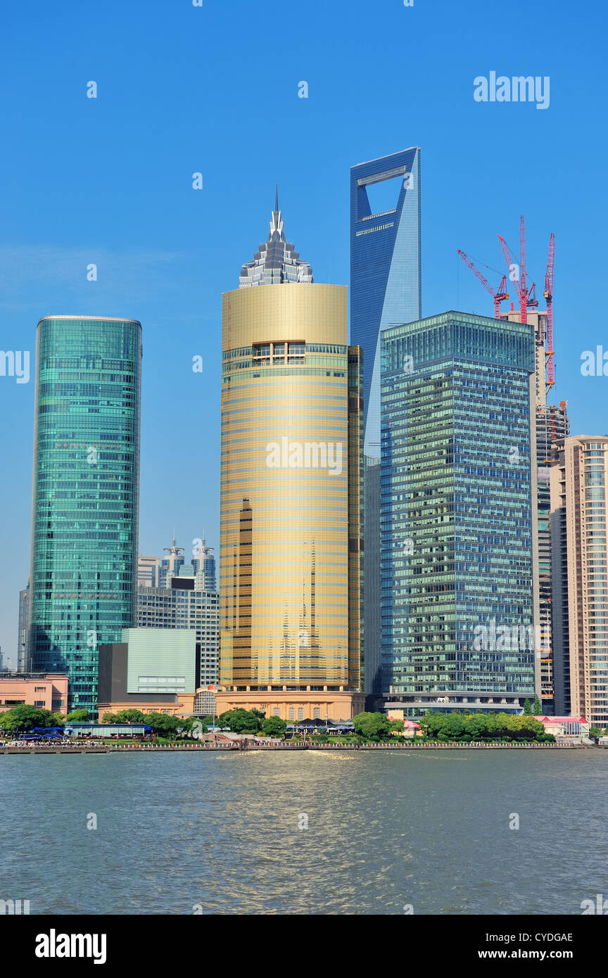 Shanghai skyline with skyscrapers and blue clear sky over Huangpu River ...