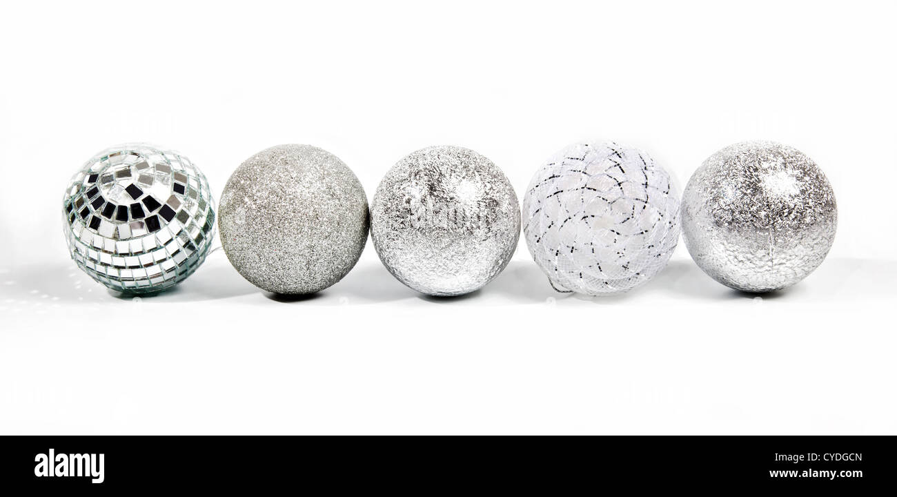 Five different silver new year balls Stock Photo - Alamy