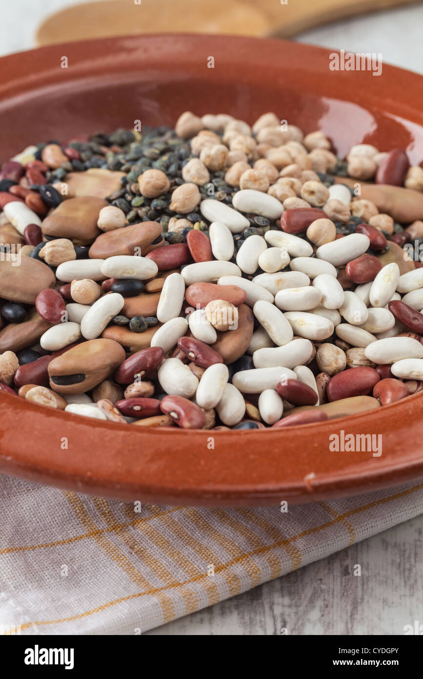 Raw mixed legumes in a ceramic plate on the table Stock Photo - Alamy