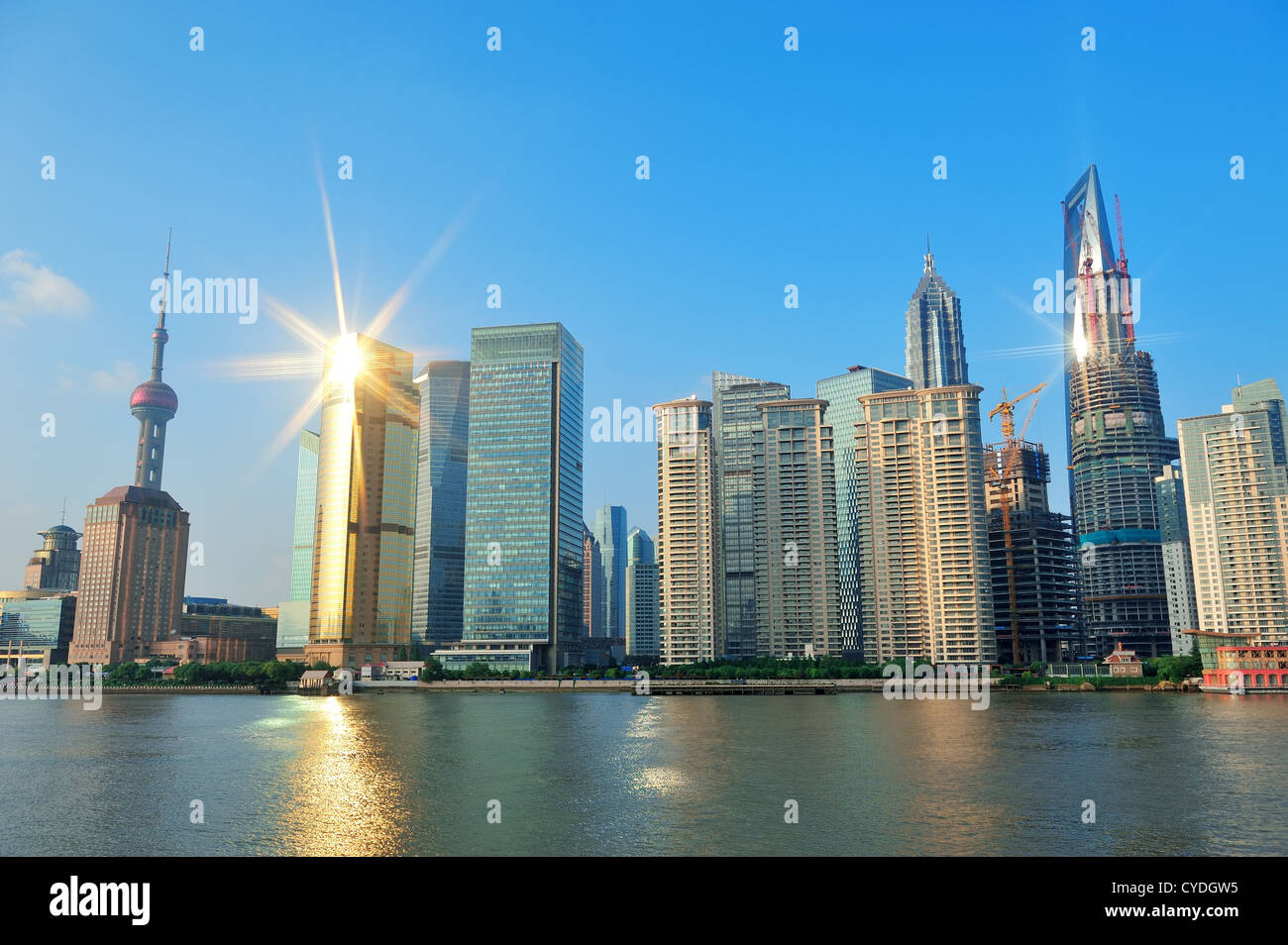 Shanghai urban architecture and skyline with sun light reflection over ...