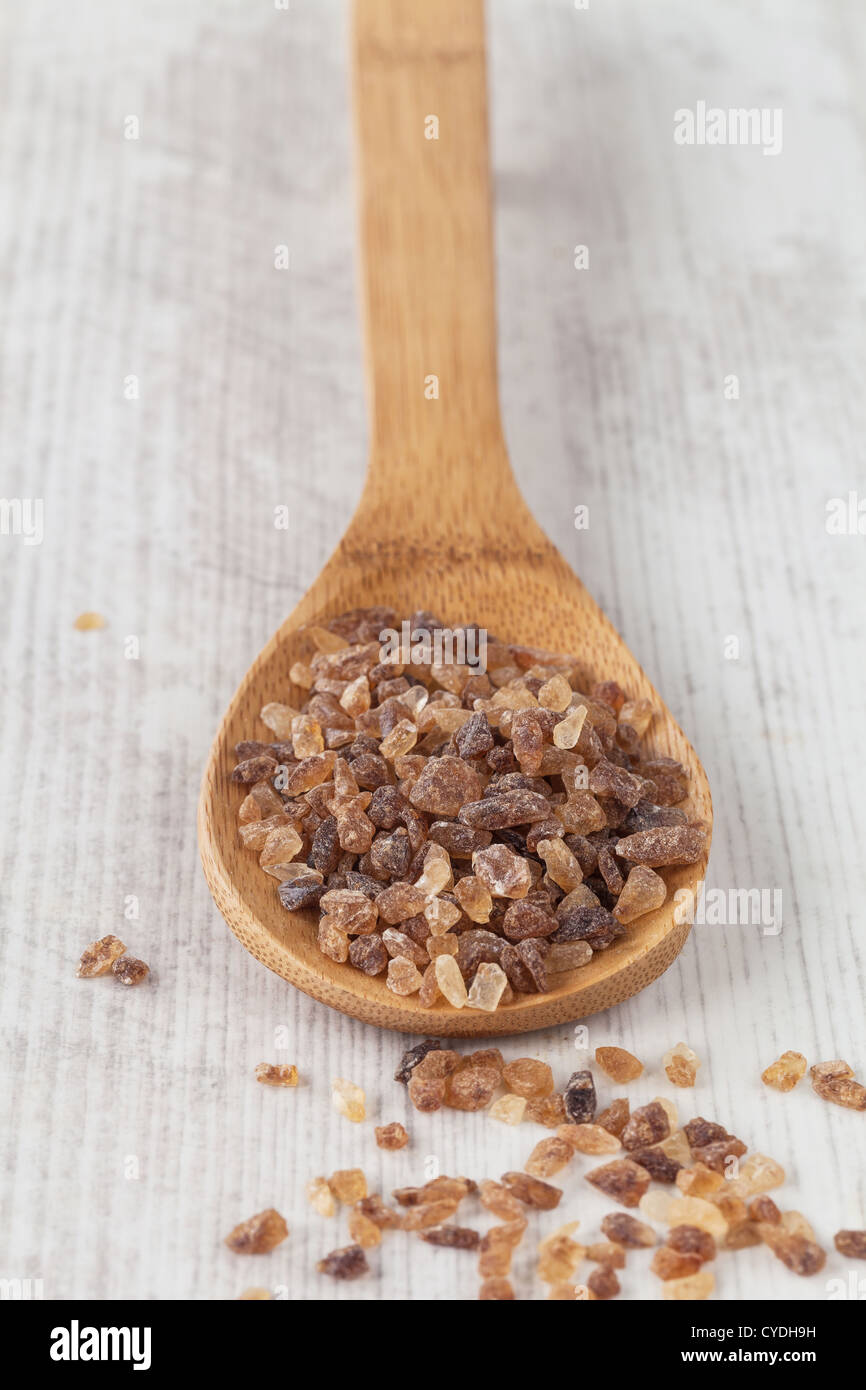 Bunch of tasty sugar grains on a wooden spoon Stock Photo - Alamy