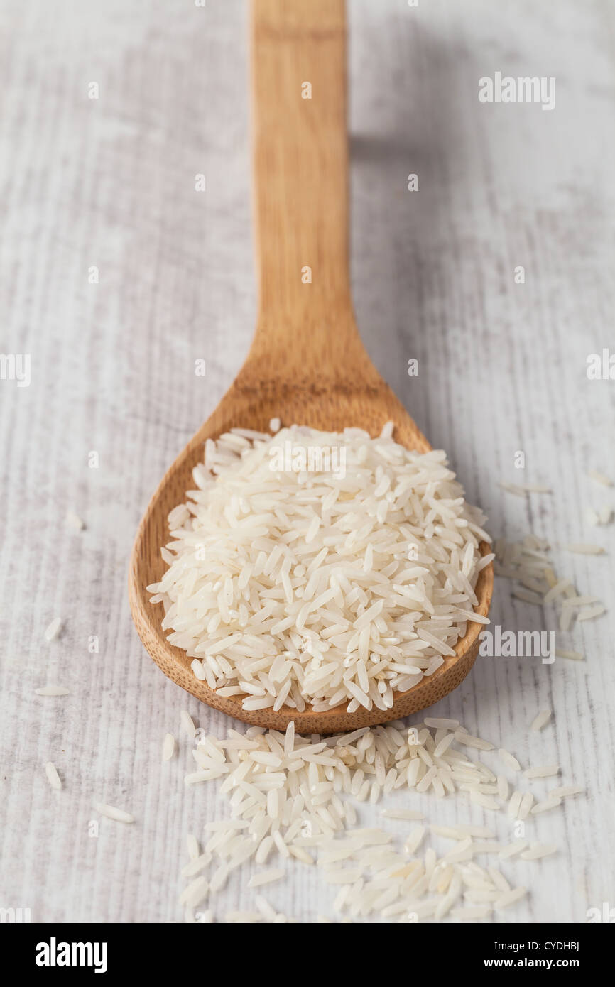 Bunch of white basmati rice on a wooden spoon Stock Photo - Alamy
