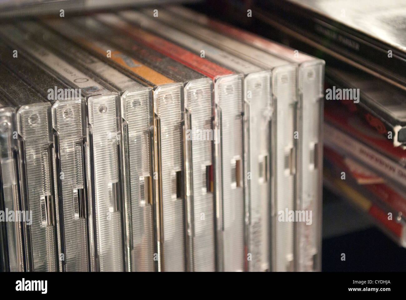 Top edges of a row of old dusty CD cases Stock Photo - Alamy