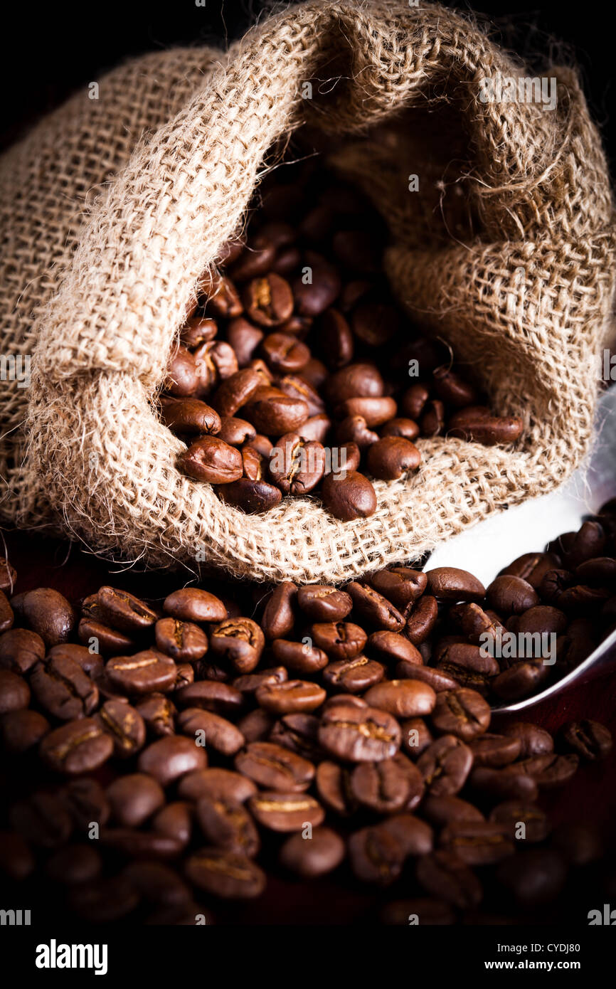 Coffe beans spilling from burlap bag Stock Photo - Alamy