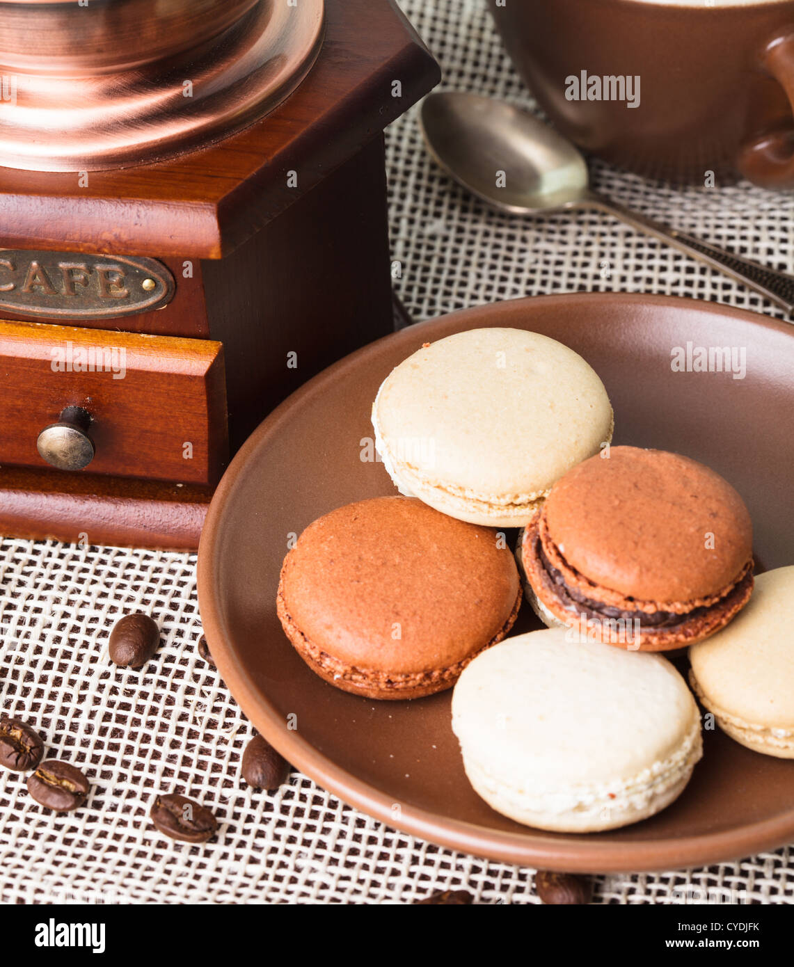 Three macaroons chocolate vanilla hi-res stock photography and images ...