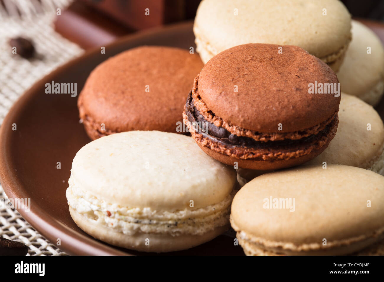 Three colors of macaroons in brown and beige tones Stock Photo - Alamy