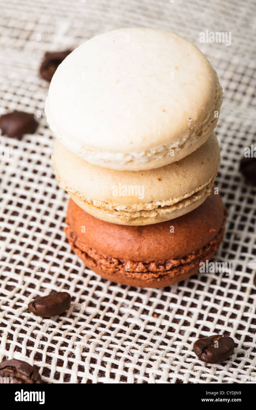 Three macaroons chocolate vanilla hi-res stock photography and images ...