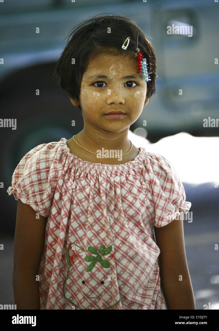 Girl With Thanaka On Cheeks, Rangoon, Myanmar Stock Photo - Alamy