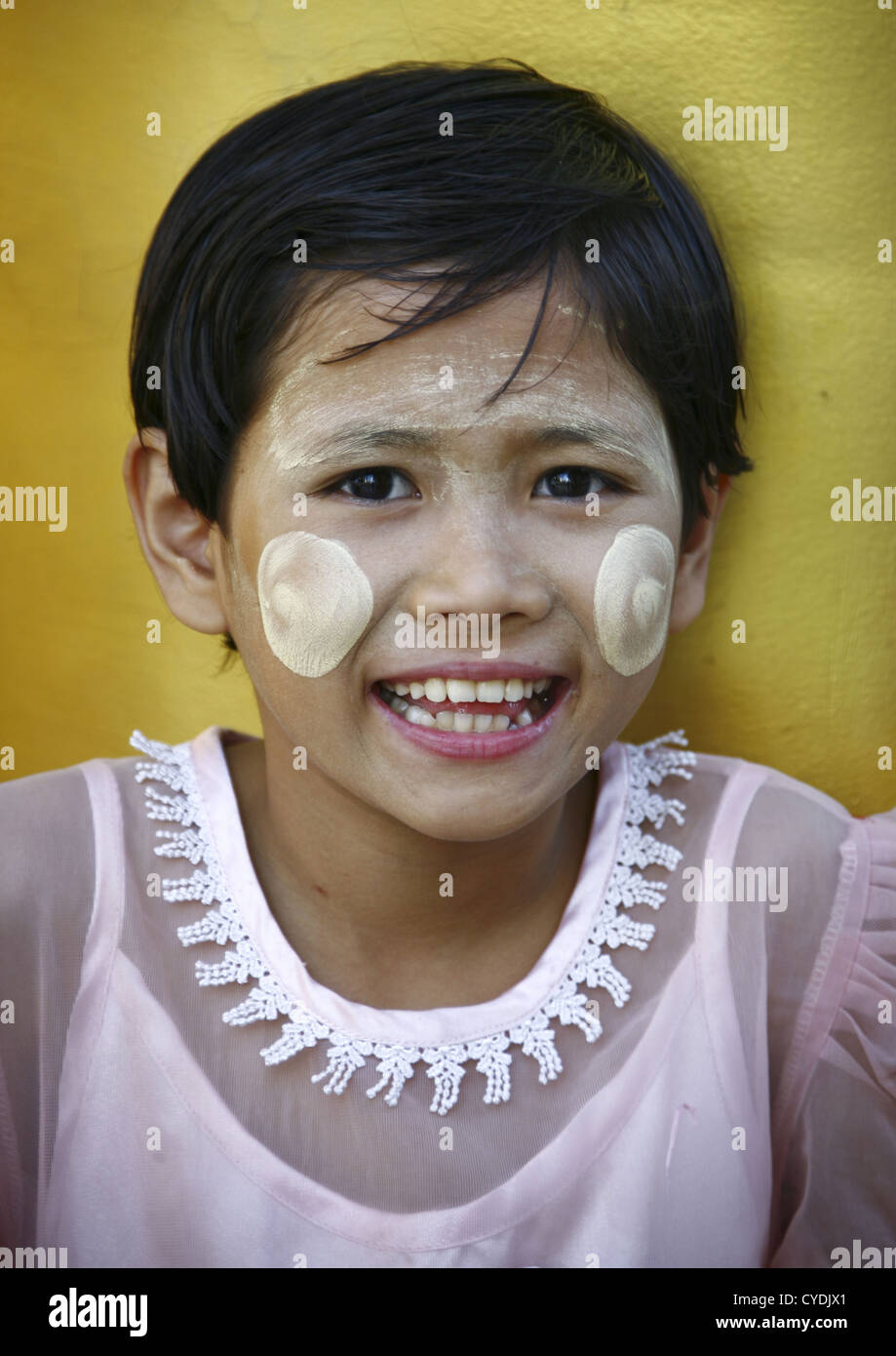 A Young Girl Smiling With Thanaka On Cheeks, Rangoon, Myanmar Stock ...