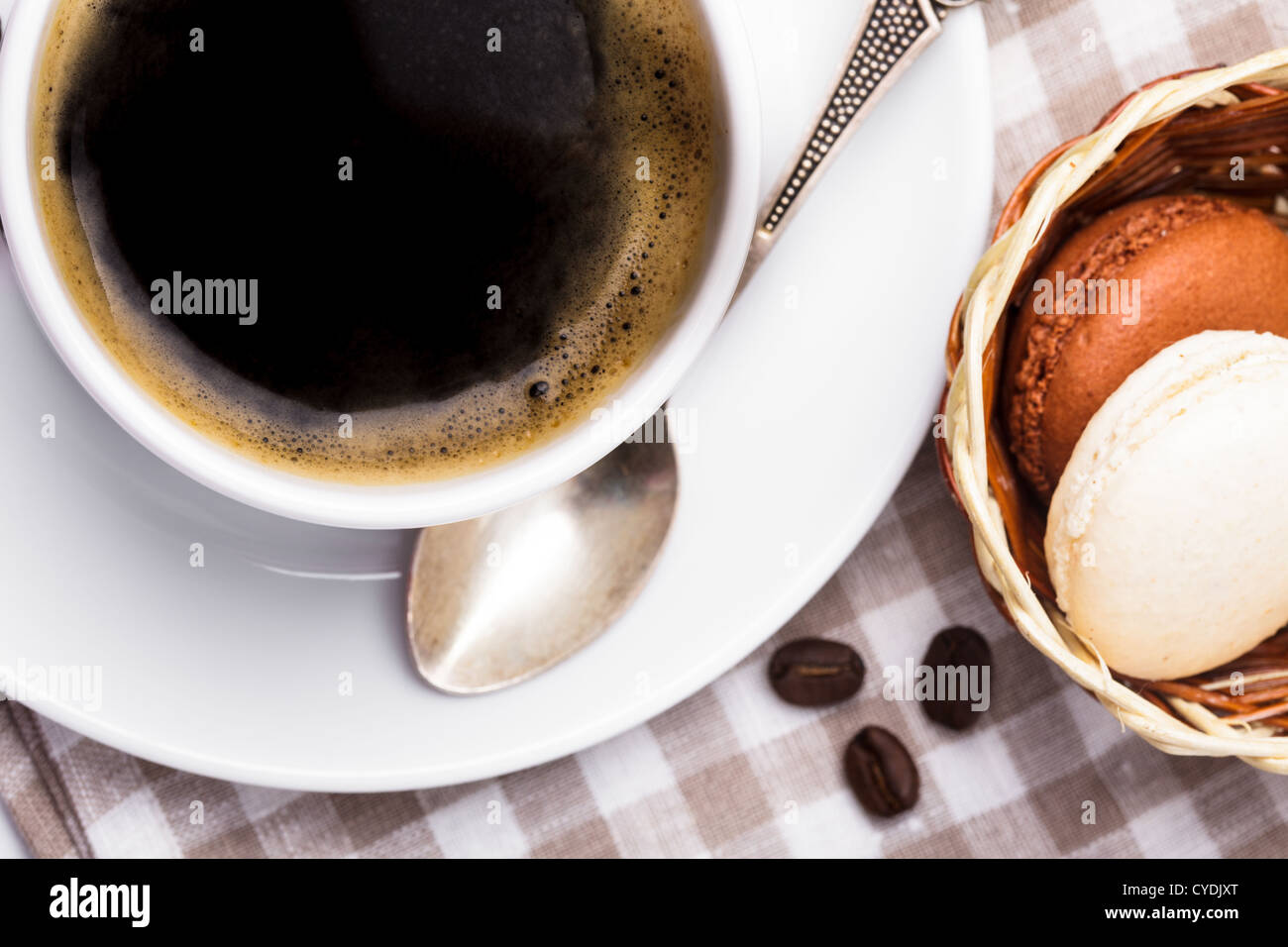 Three colors of macaroons in brown and beige tones Stock Photo - Alamy