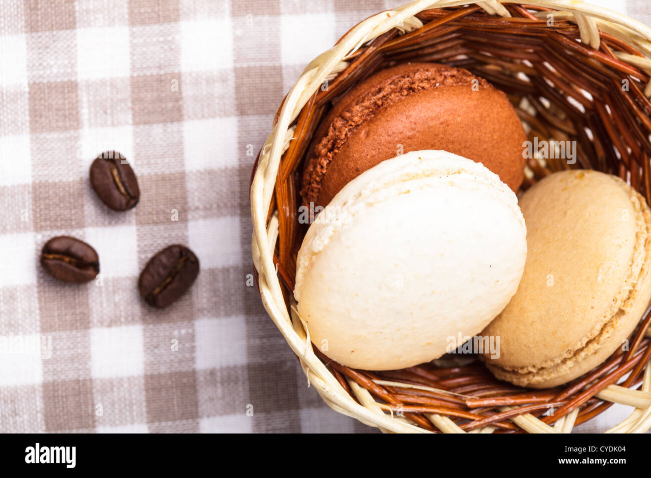 Three colors of macaroons in brown and beige tones Stock Photo - Alamy