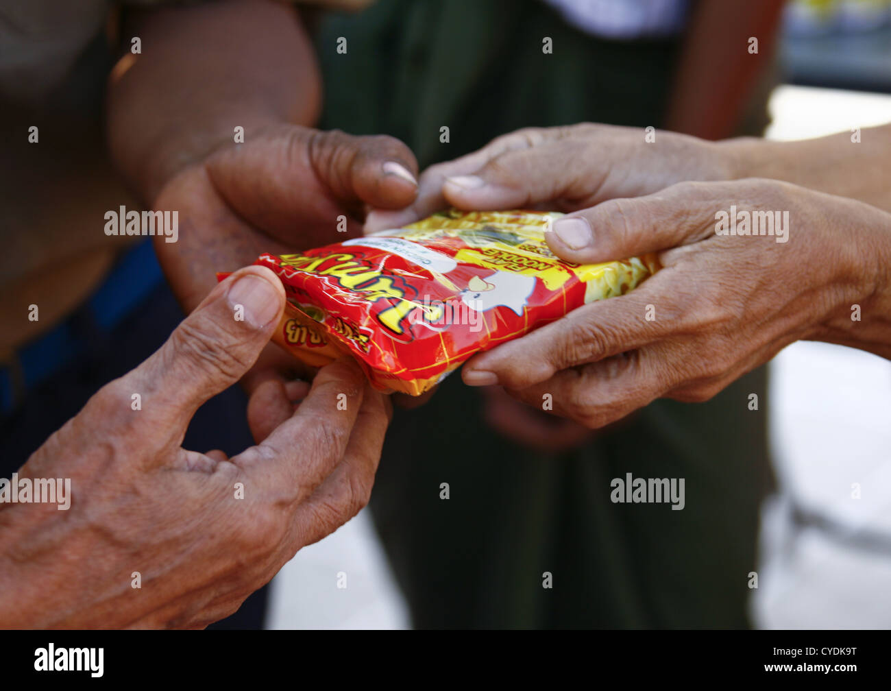 People giving offerings to monk hi-res stock photography and images - Alamy