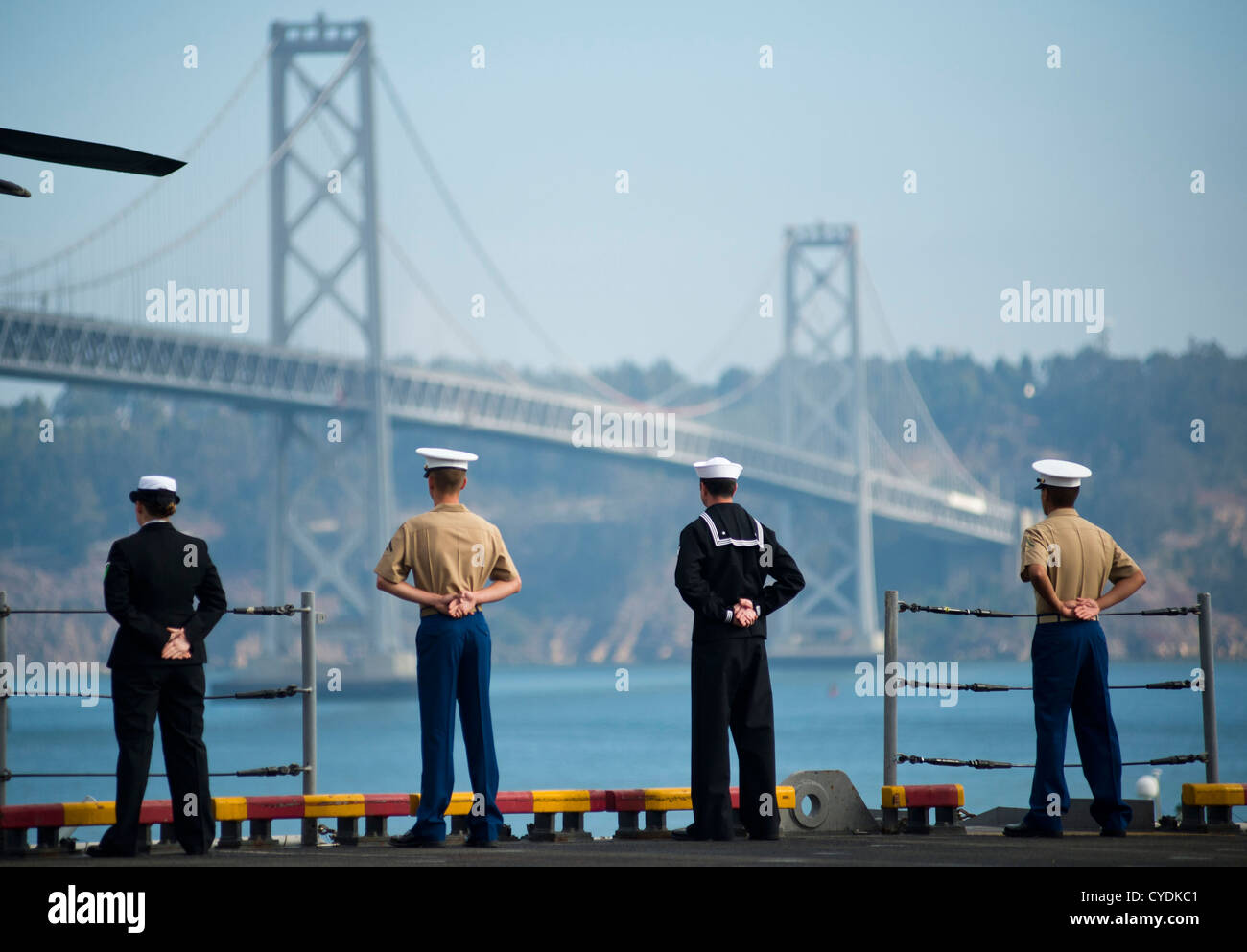 Sailors and Marines man the rails of the amphibious assault ship USS ...