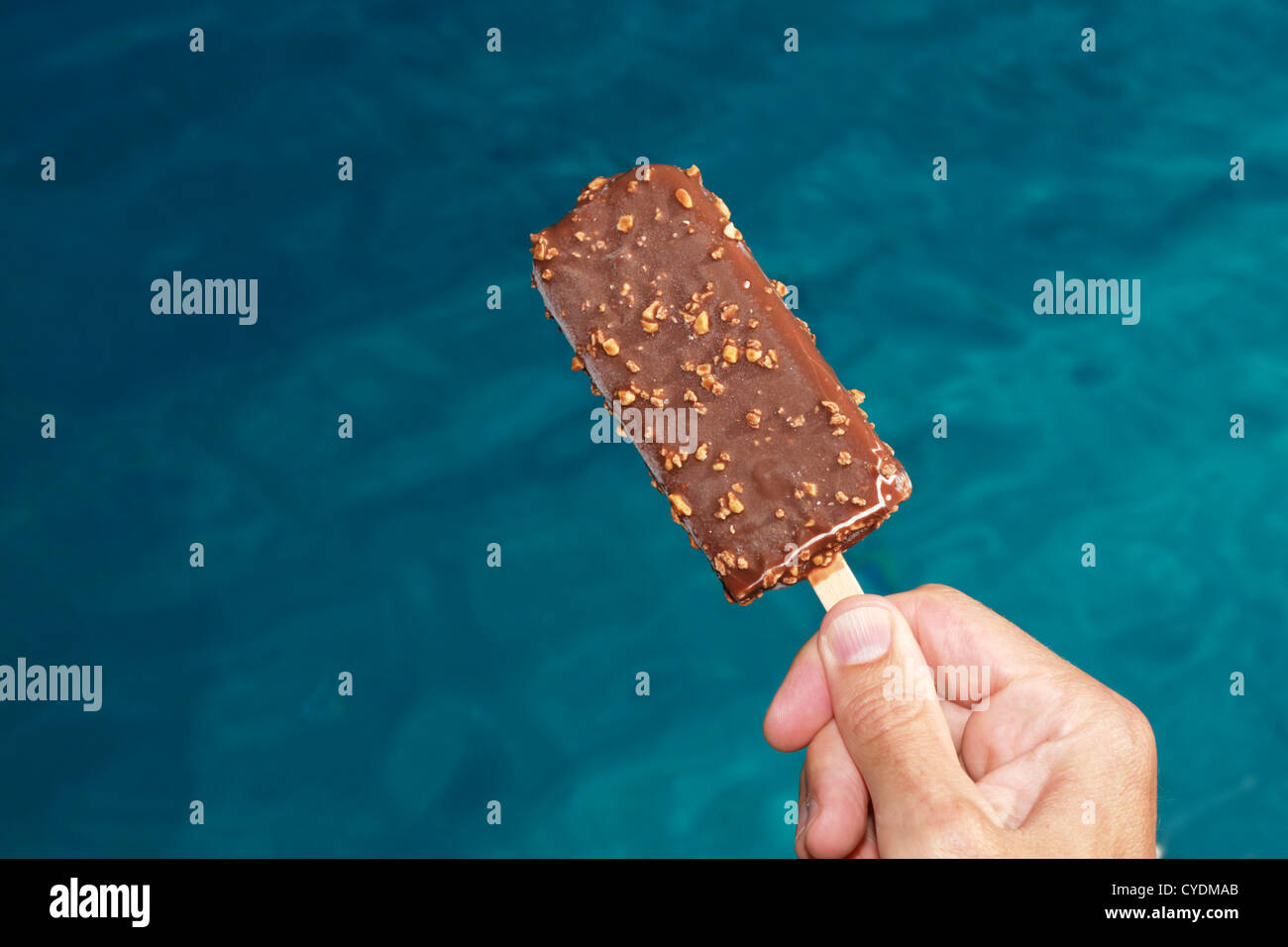 popsicle against a swimming pool on a hot day Stock Photo - Alamy