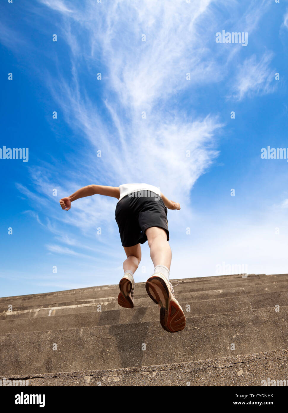 Man running up stairs Stock Photo - Alamy