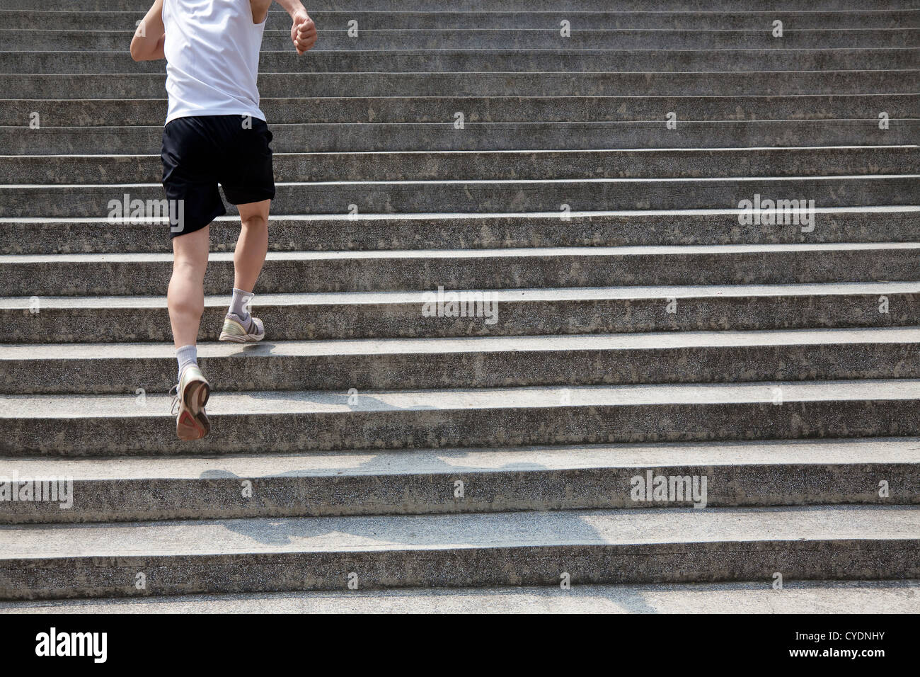 running man on stairs Stock Photo - Alamy