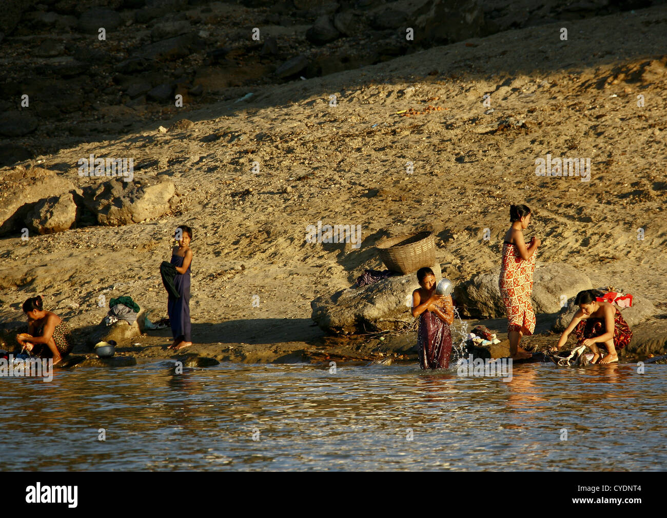 Women Taking Bath On Irrawaddy River Banks, Myanmar Stock Photo - Alamy