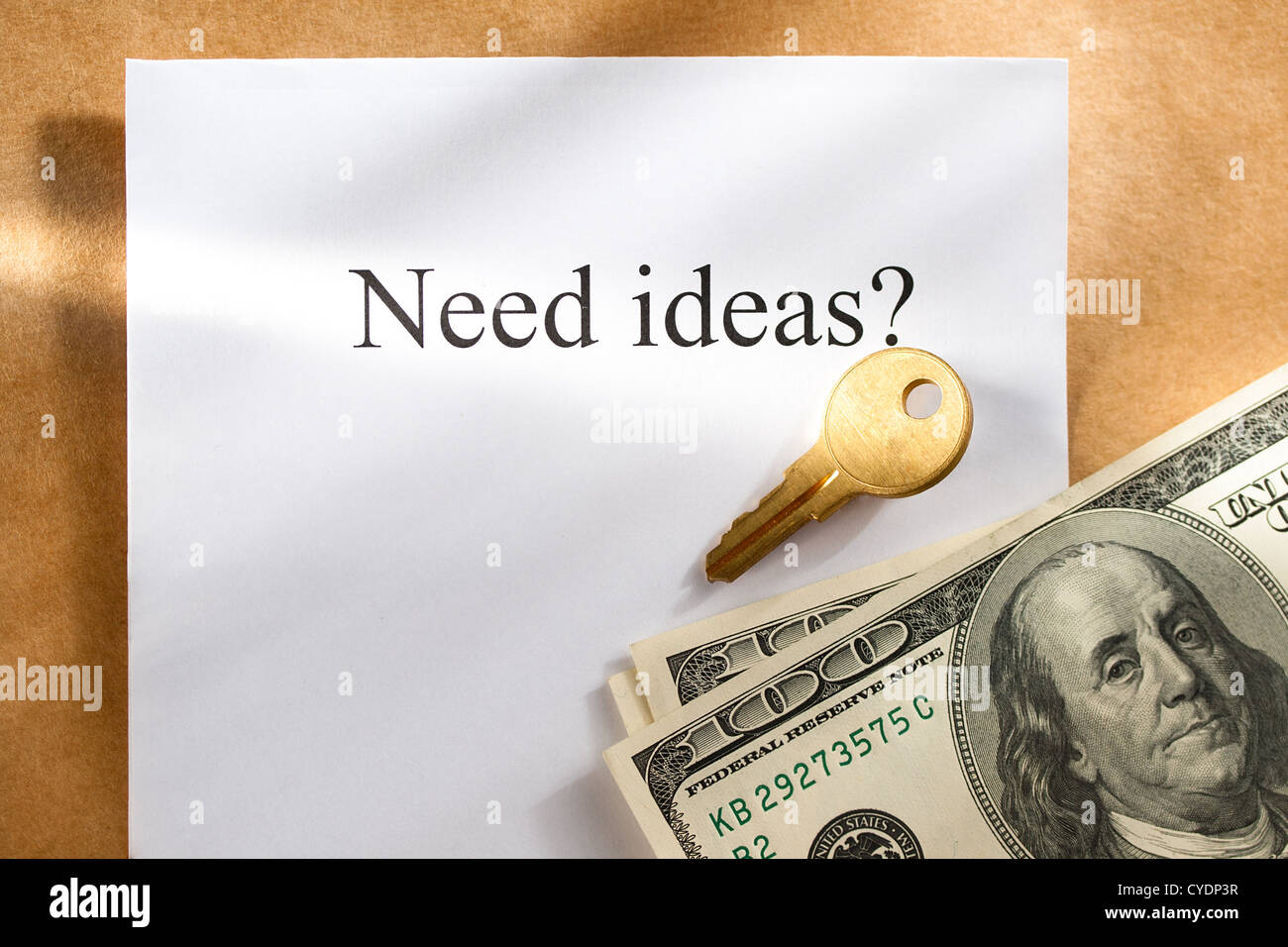 Idea conception with key and money Stock Photo - Alamy