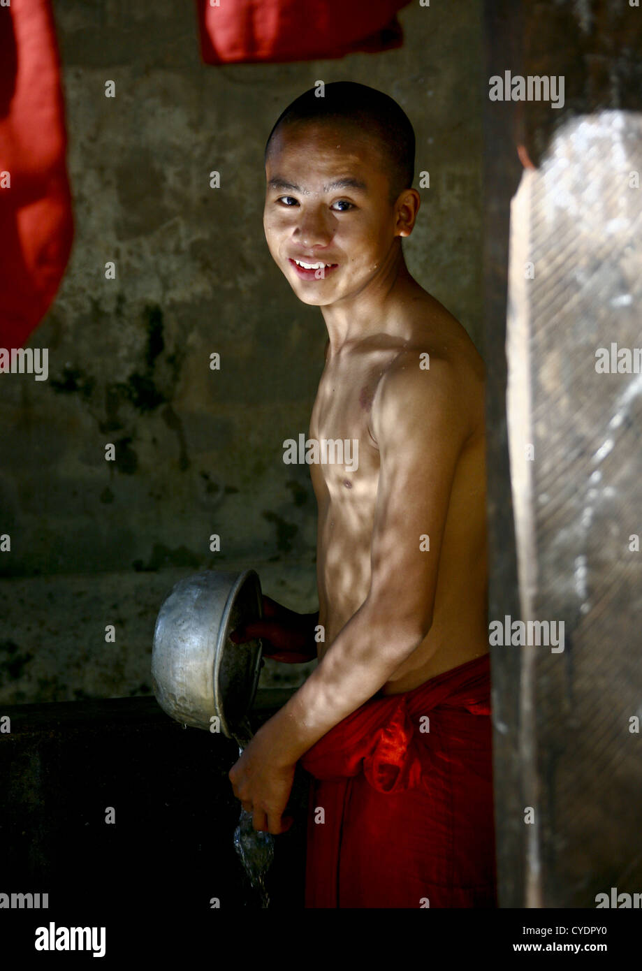 Novice Buddhist Monk Taking A Bath, Rangoon, Myanmar Stock Photo - Alamy