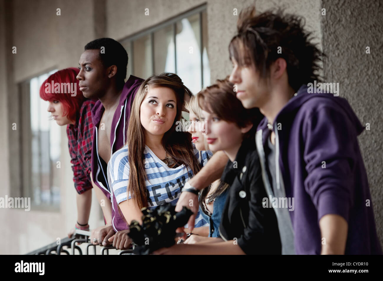 The camera focuses on an attractive young punk girl who poses for the ...