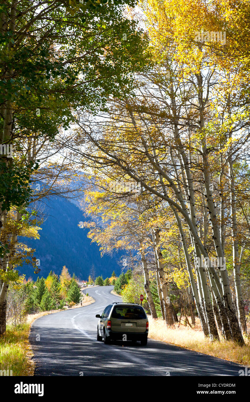 Driving through Rocky Mountain National Park during the fall foliage ...