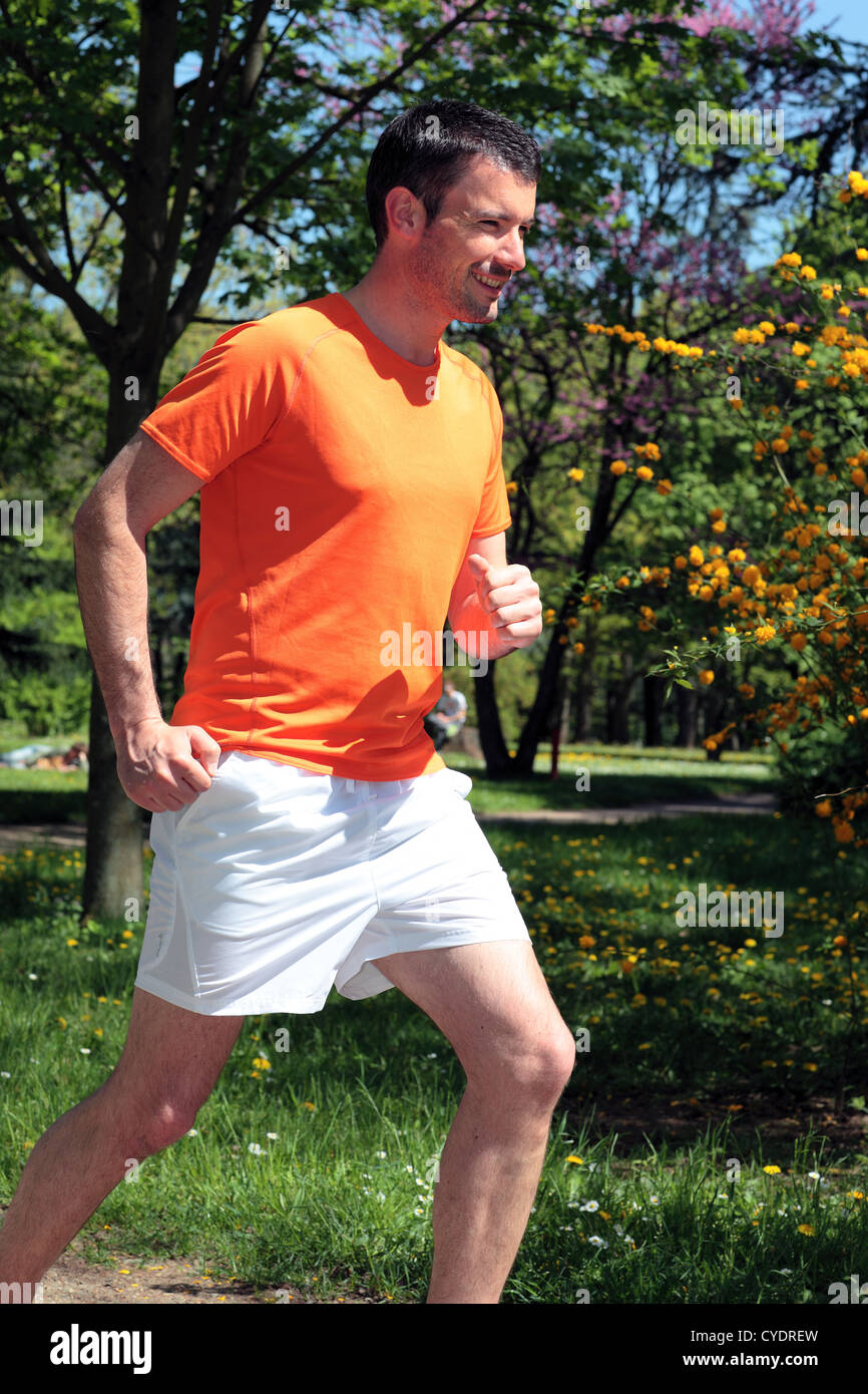 man running in a park in summer Stock Photo - Alamy