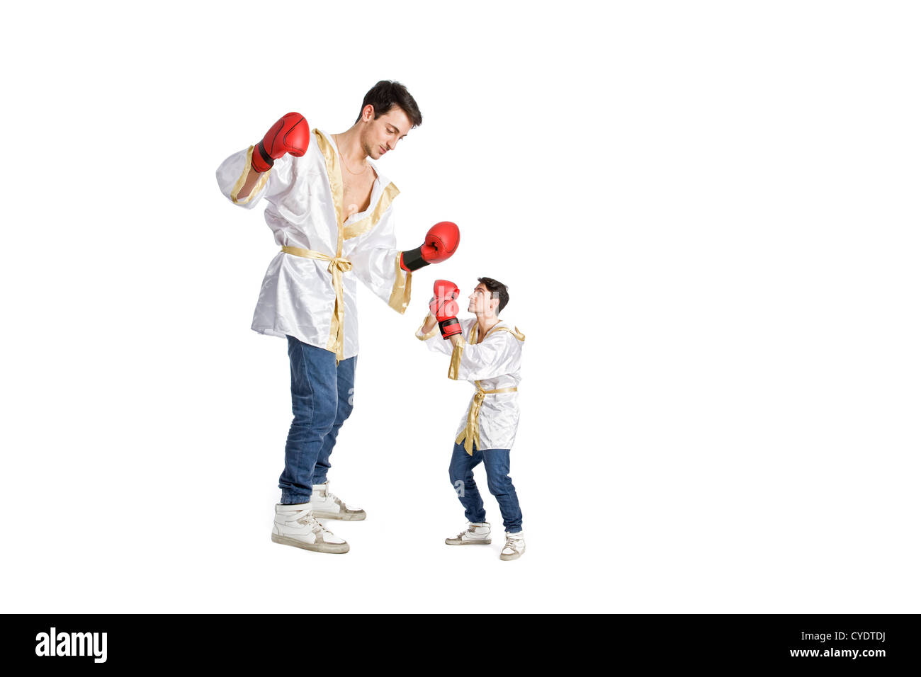 conceptual disadvantage photo showing giant against dwarf on white ...