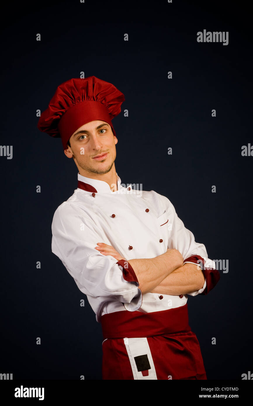 photo of young successful chef in front of a blue background Stock ...