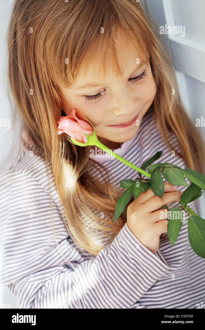 Child holding rose Stock Photo - Alamy