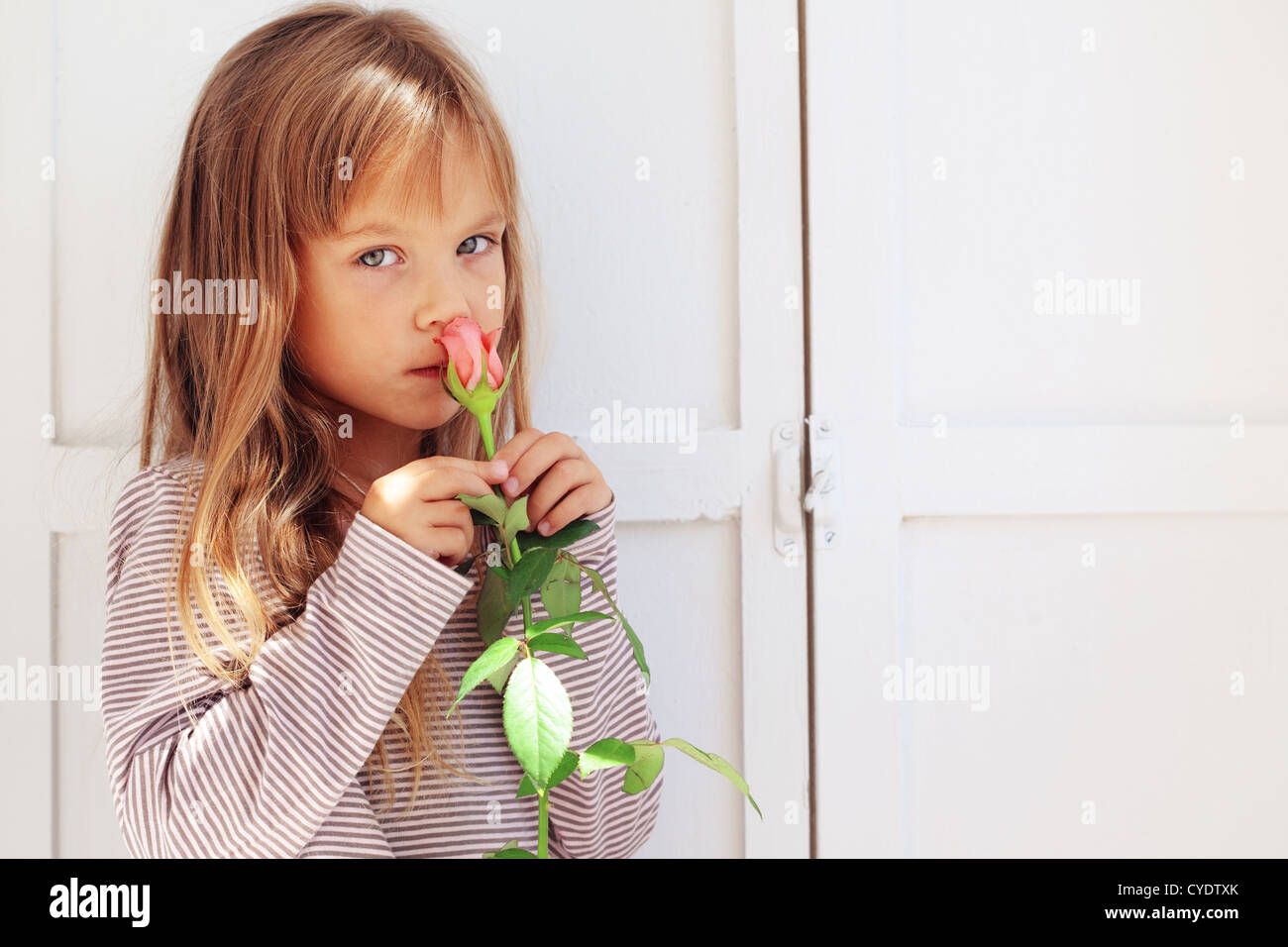 Child holding rose Stock Photo - Alamy